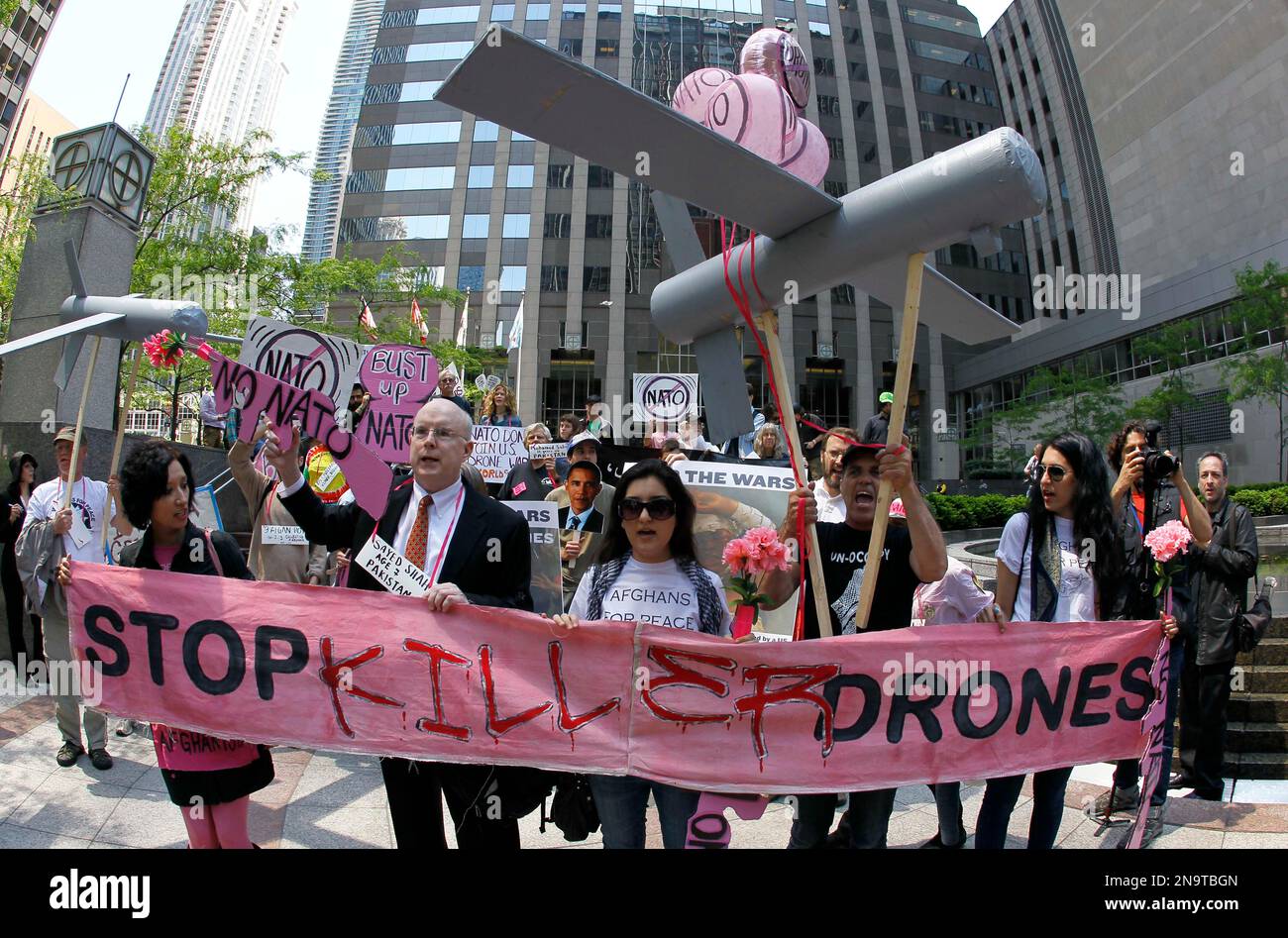 About 100 anti-war activists demonstrate outside the Canadian Consulate ...