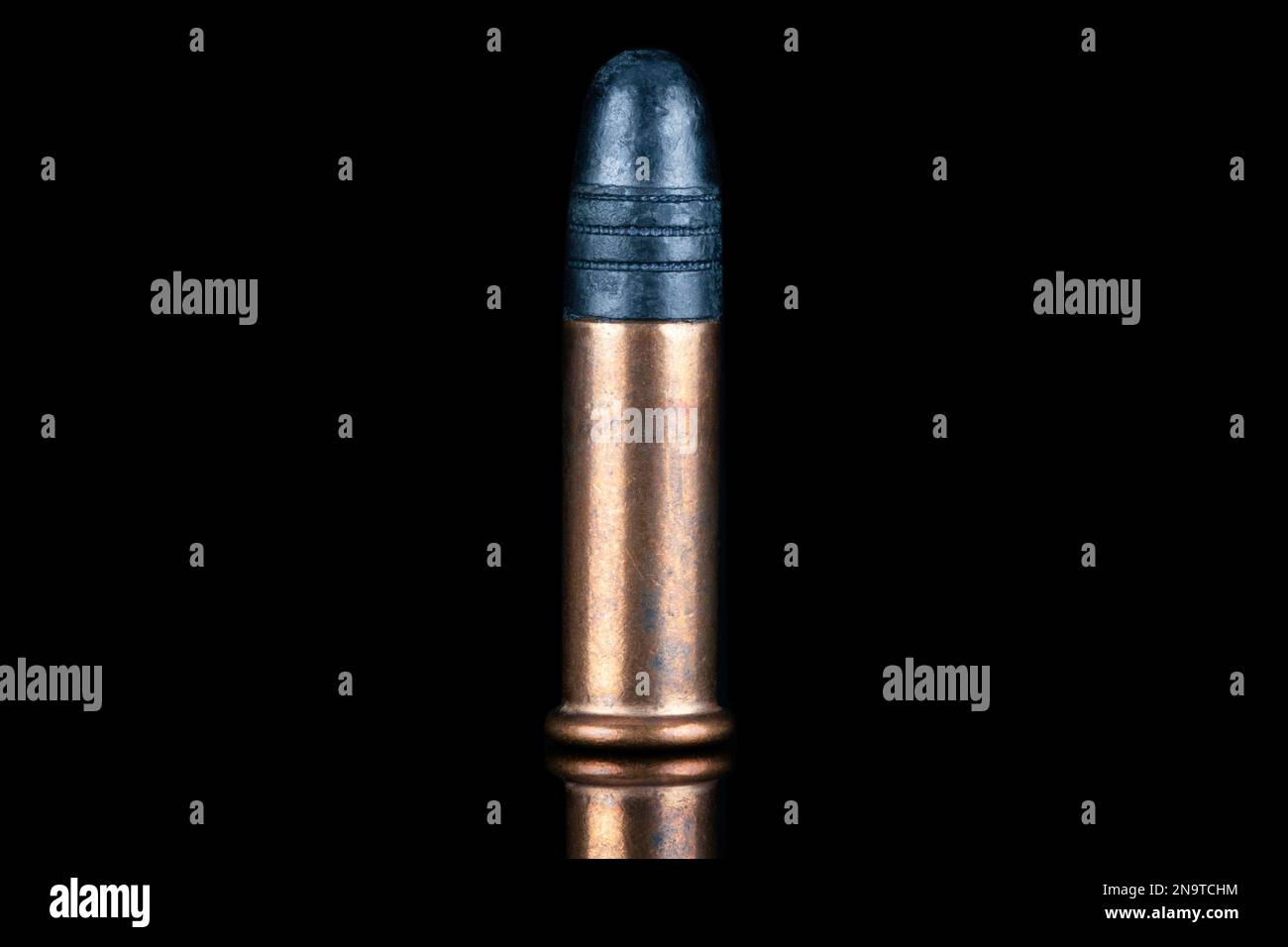 22 caliber round isolated on black background with reflexion Stock ...