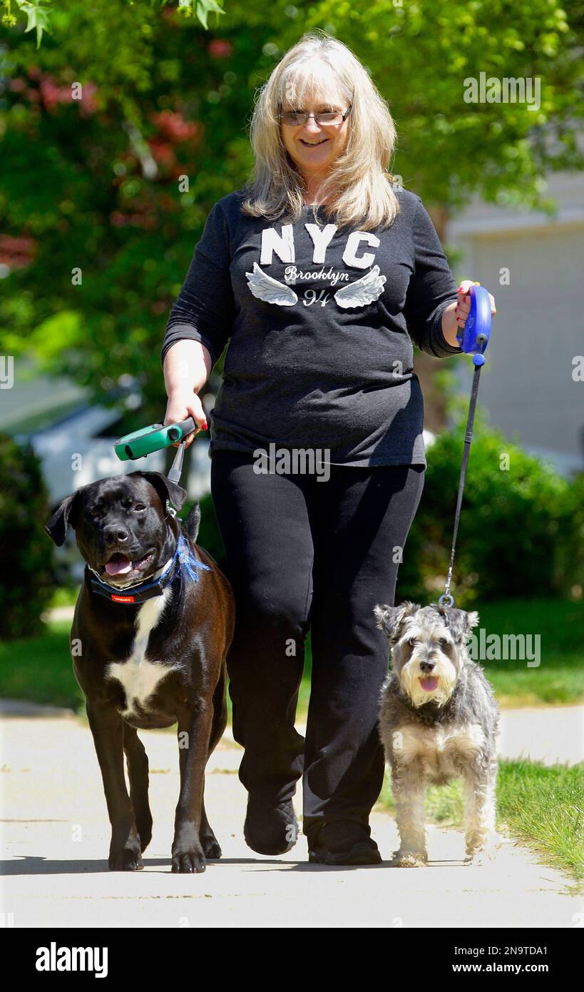 Harriet Buscombe is seen with her two dogs, Hazel the schnauzer and ...