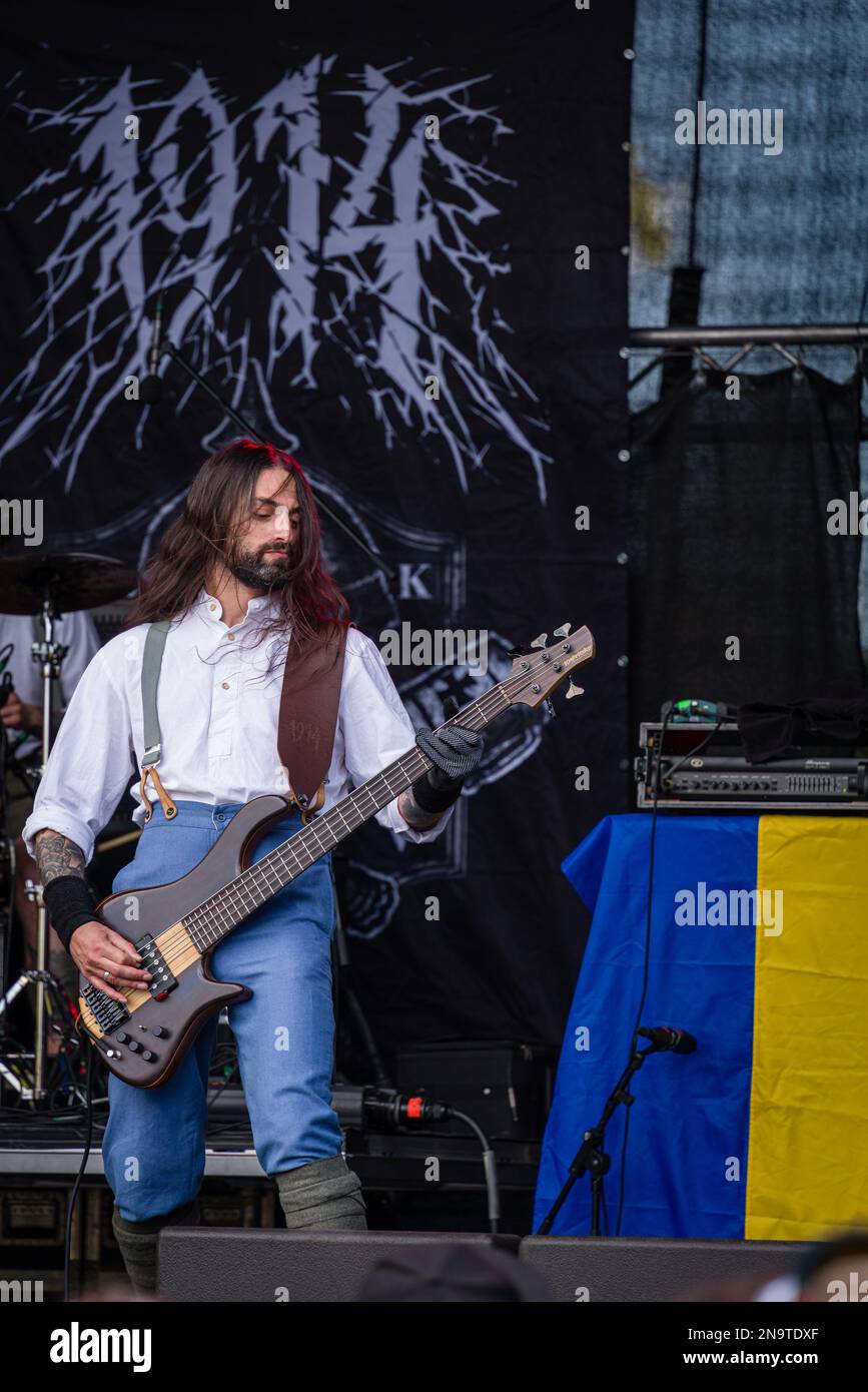 A scenic view of Band 1914 guitarist performing on Brutal Assault 2022 ...