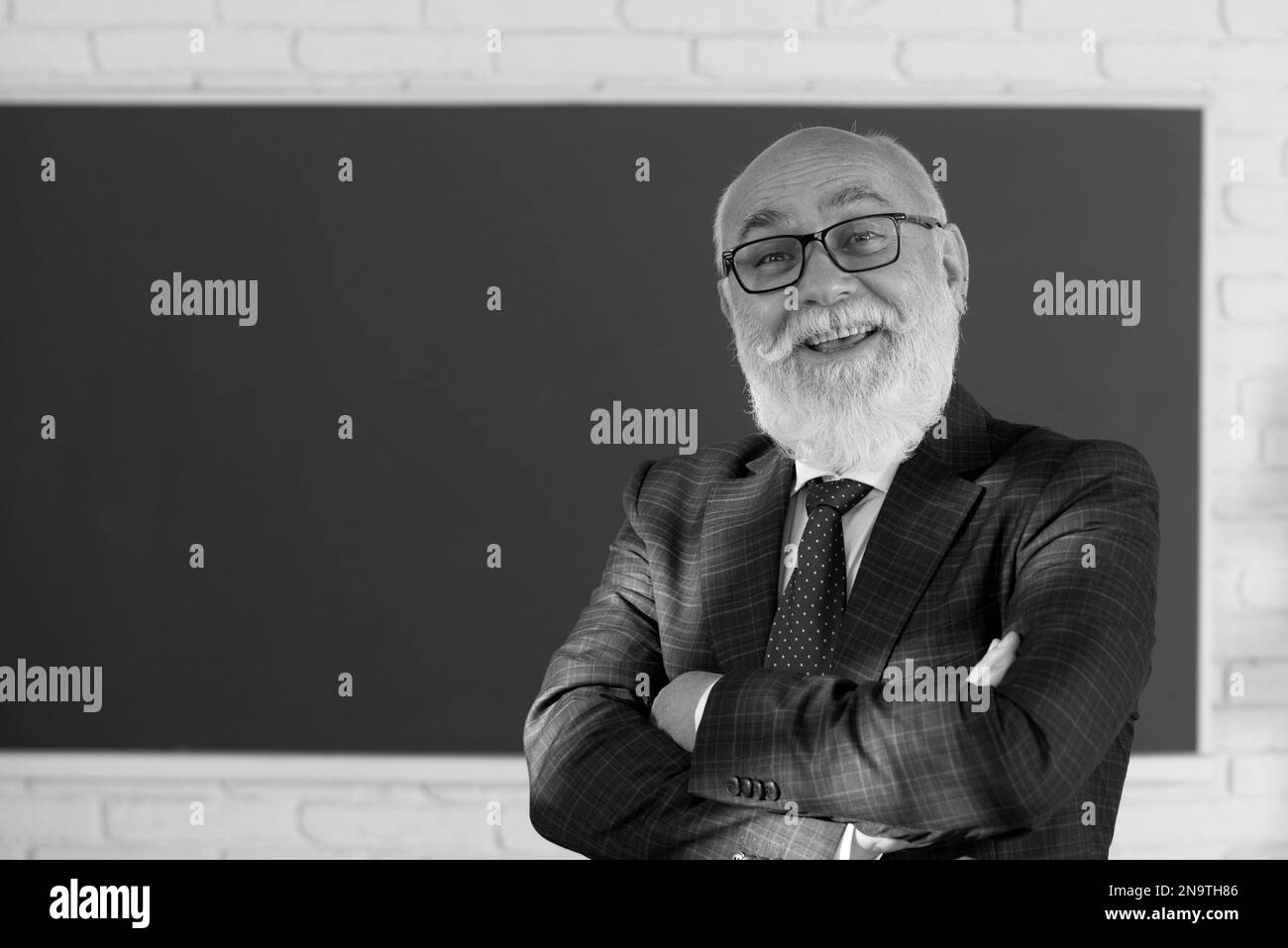 Funny Senior professor. Portrait of happy senior teacher with arms ...