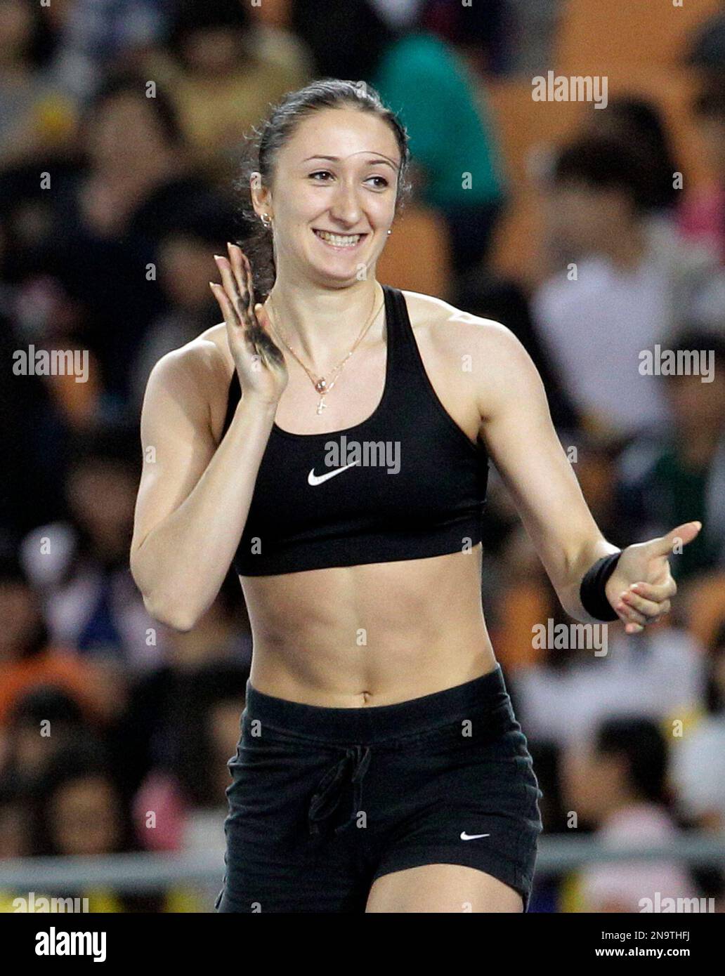 Anastasia Savchenko of Russia reacts while competing in the women's ...