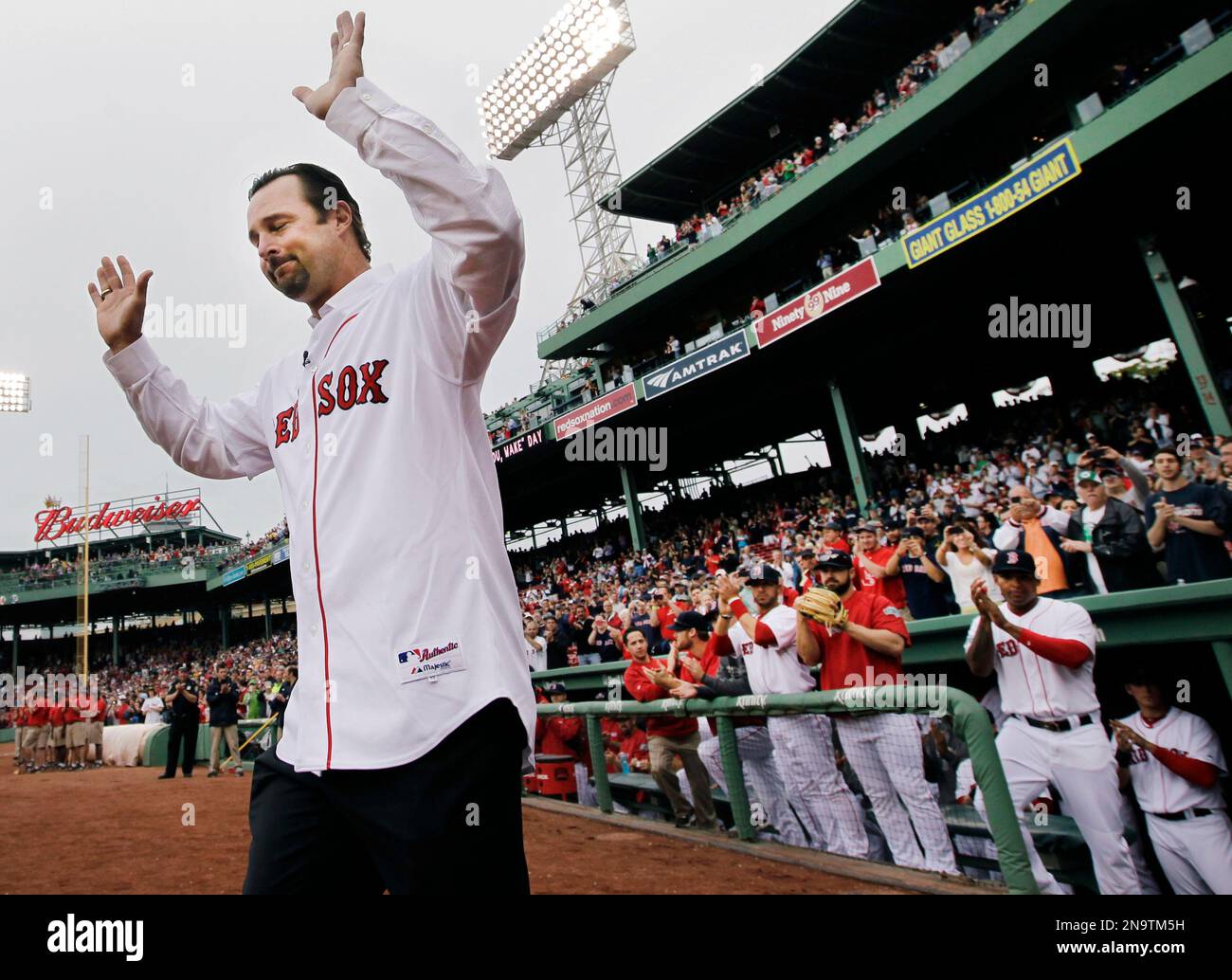 Newly retired Boston Red Sox pitcher Tim Wakefield reacts as he is ...