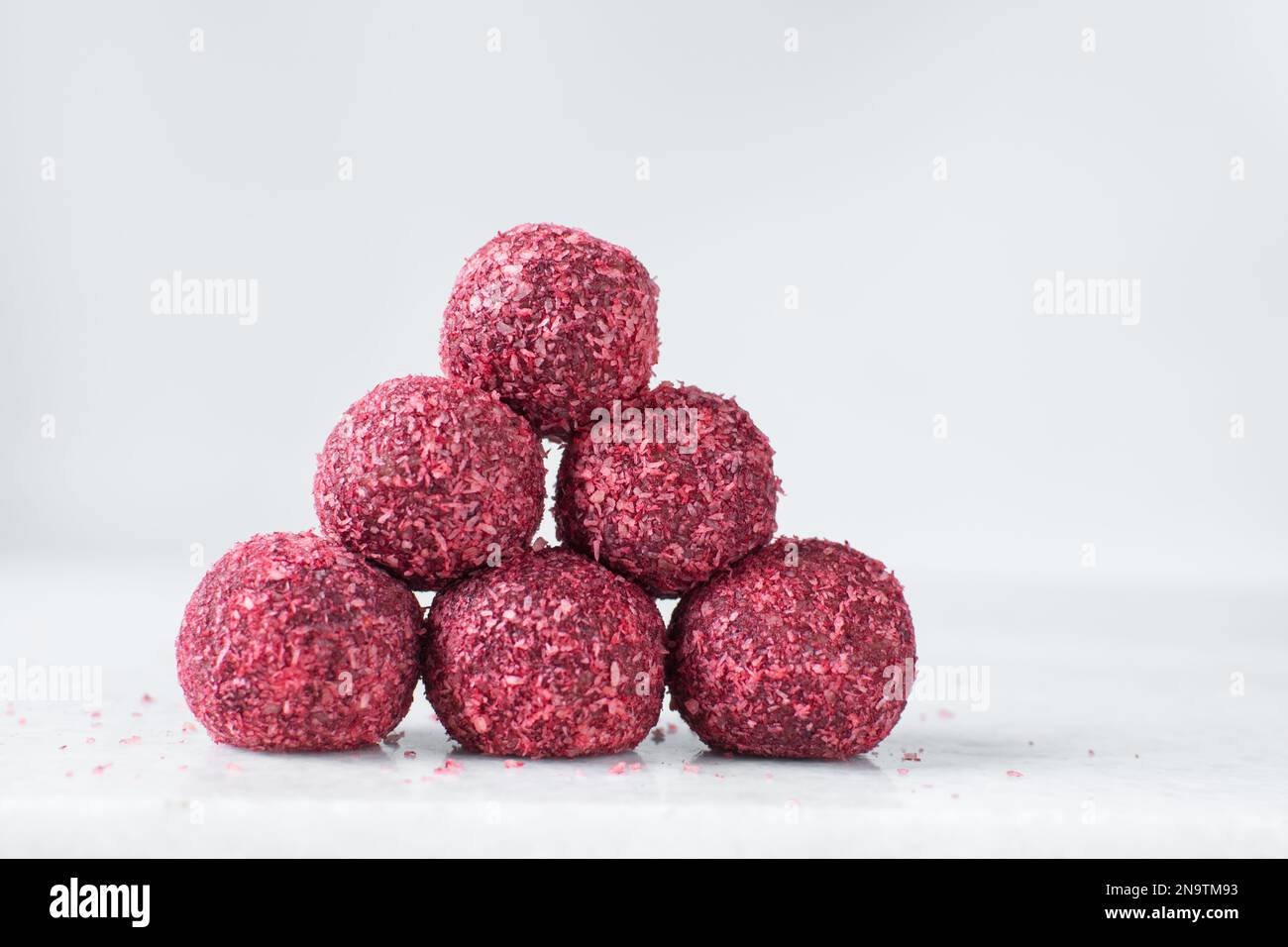 Raspberry coconut and chocolate truffles, homemade chocolate bonbons on ...