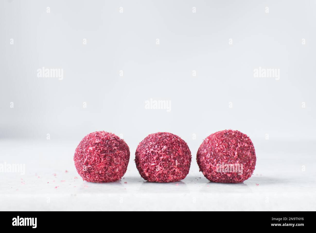 Raspberry coconut and chocolate truffles, homemade chocolate bonbons on ...
