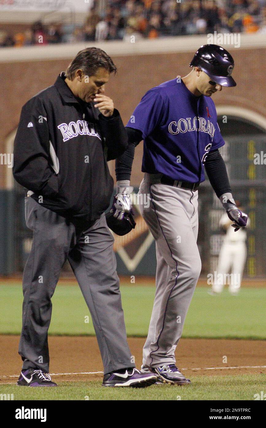 Colorado Rockies' Troy Tulowitzki, right, leaves the game after hitting ...