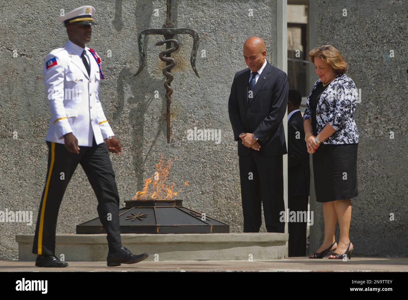 Haiti's President Michel Martelly, center, and his wife Sophia Martelly ...