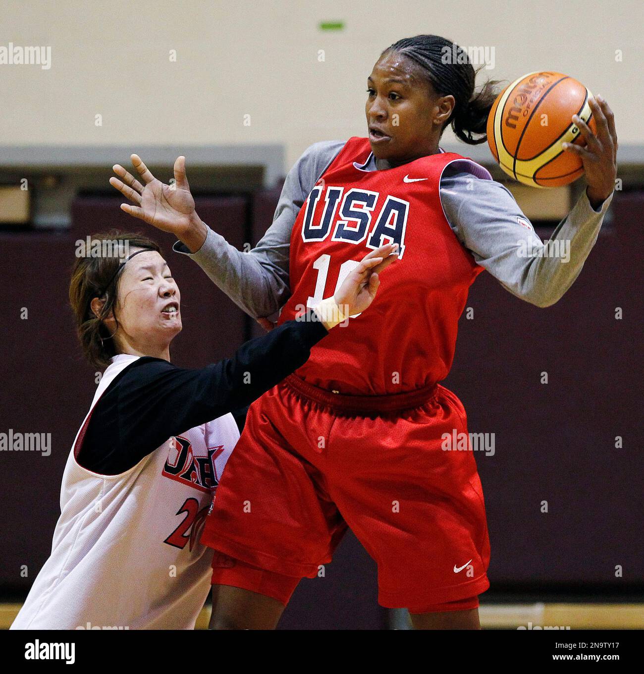 United States' Tamika Catchings, right, grabs a rebound in front of ...