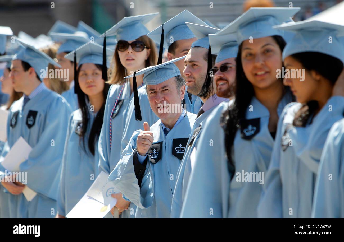 Columbia University janitor Gac Filipaj give a thumbs up during the ...