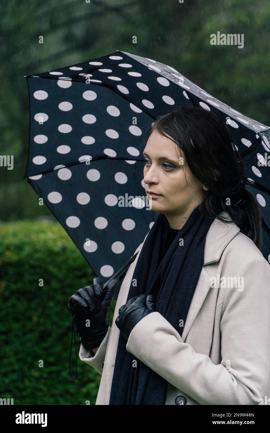 Crying with umbrella hi-res stock photography and images - Alamy