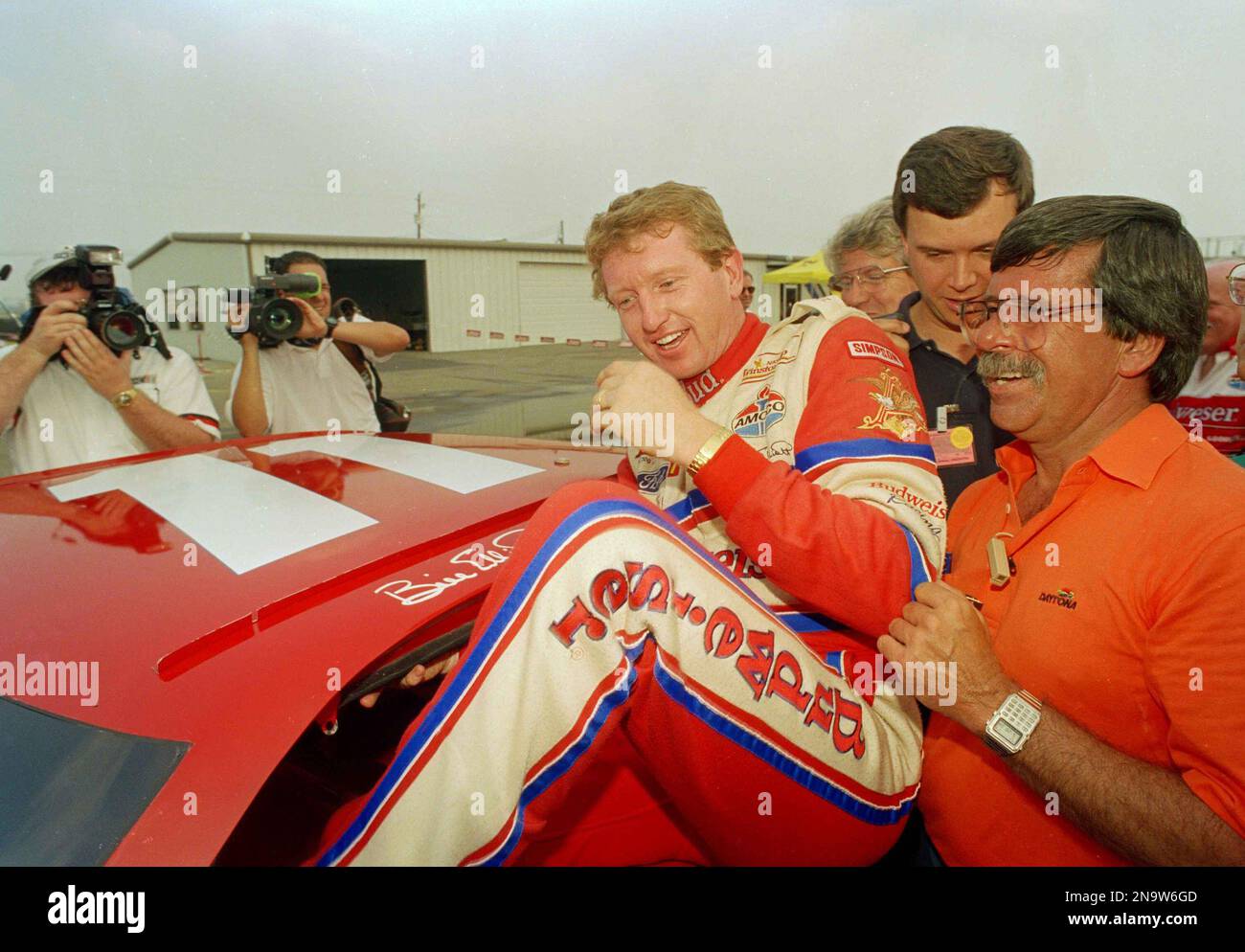 NASCAR driver Bill Elliott of Dawsonville, Ga., climbs out of his car ...