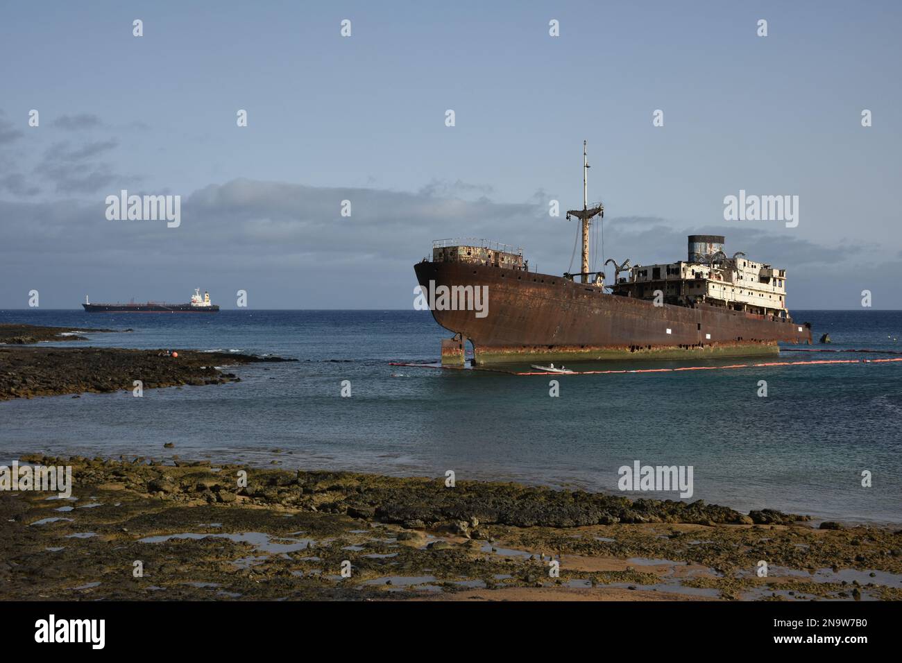 An old rusty ship in a harbor Stock Photo - Alamy