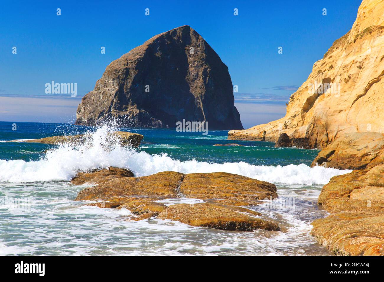 Haystack Rock on Cape Kiwanda on a bright sunny day along the Oregon ...