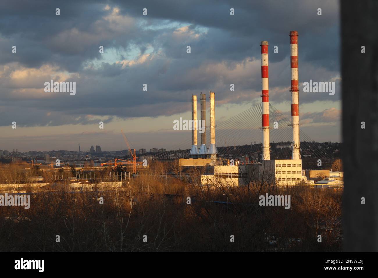 A beautiful view of heating plant constructions with a beautiful sunset ...