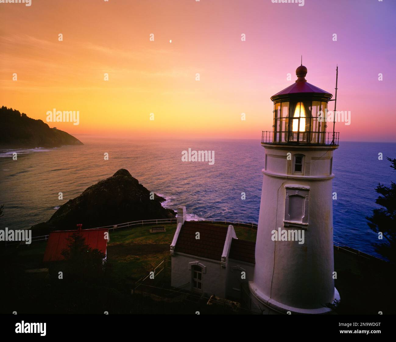 Heceta Head Light illuminated at dusk on the Oregon Coast in Heceta ...