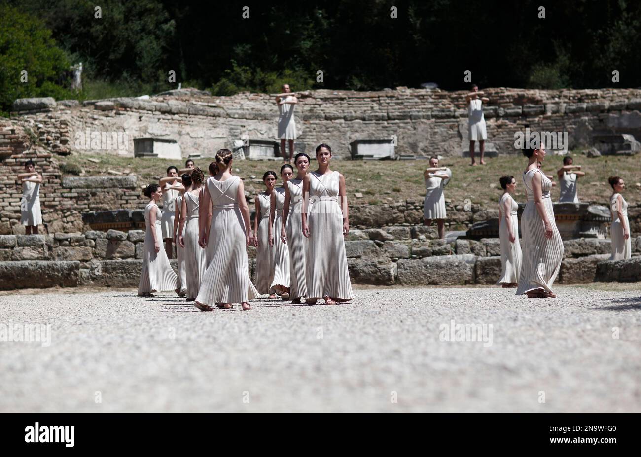 Actress dressed as ancient Greek priestesses perform a ritual dance in ...