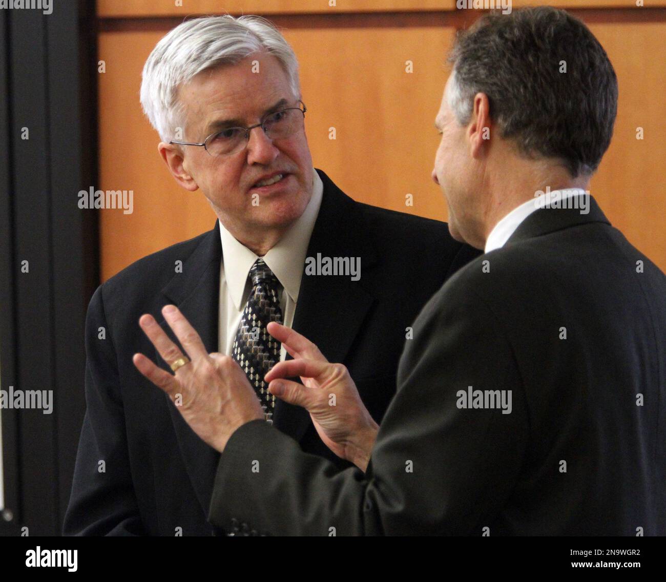 Steve Powell, left, talks to defense attorney Mark Quigley, during a ...