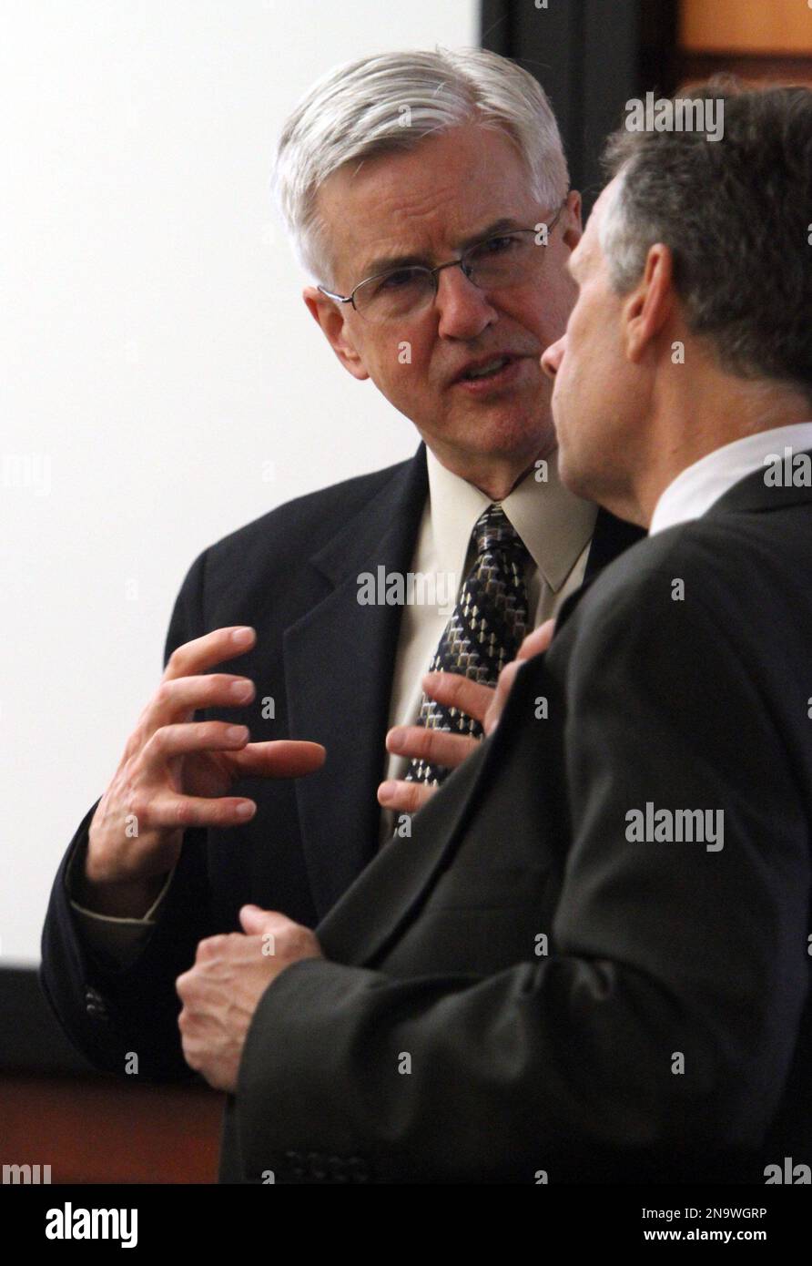 Steve Powell, left, talks to defense attorney Mark Quigley, during a ...