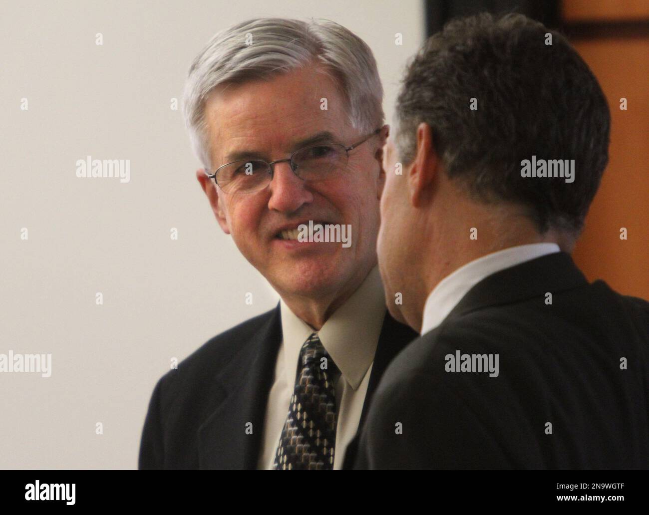 Steve Powell, left, talks to defense attorney Mark Quigley, during a ...