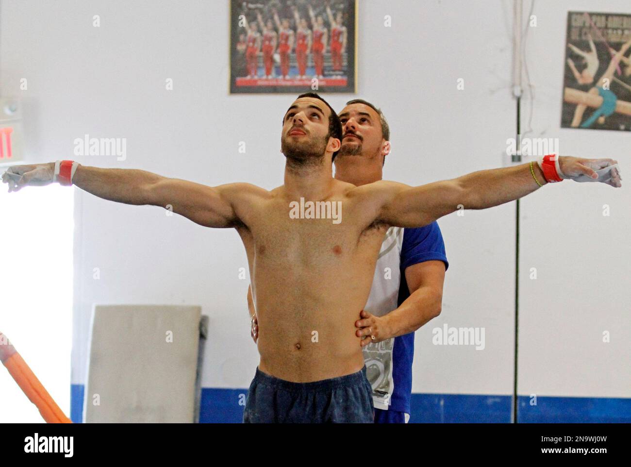 In this Tuesday, April 17, 2012, photo, Danell Leyva, front, works out ...