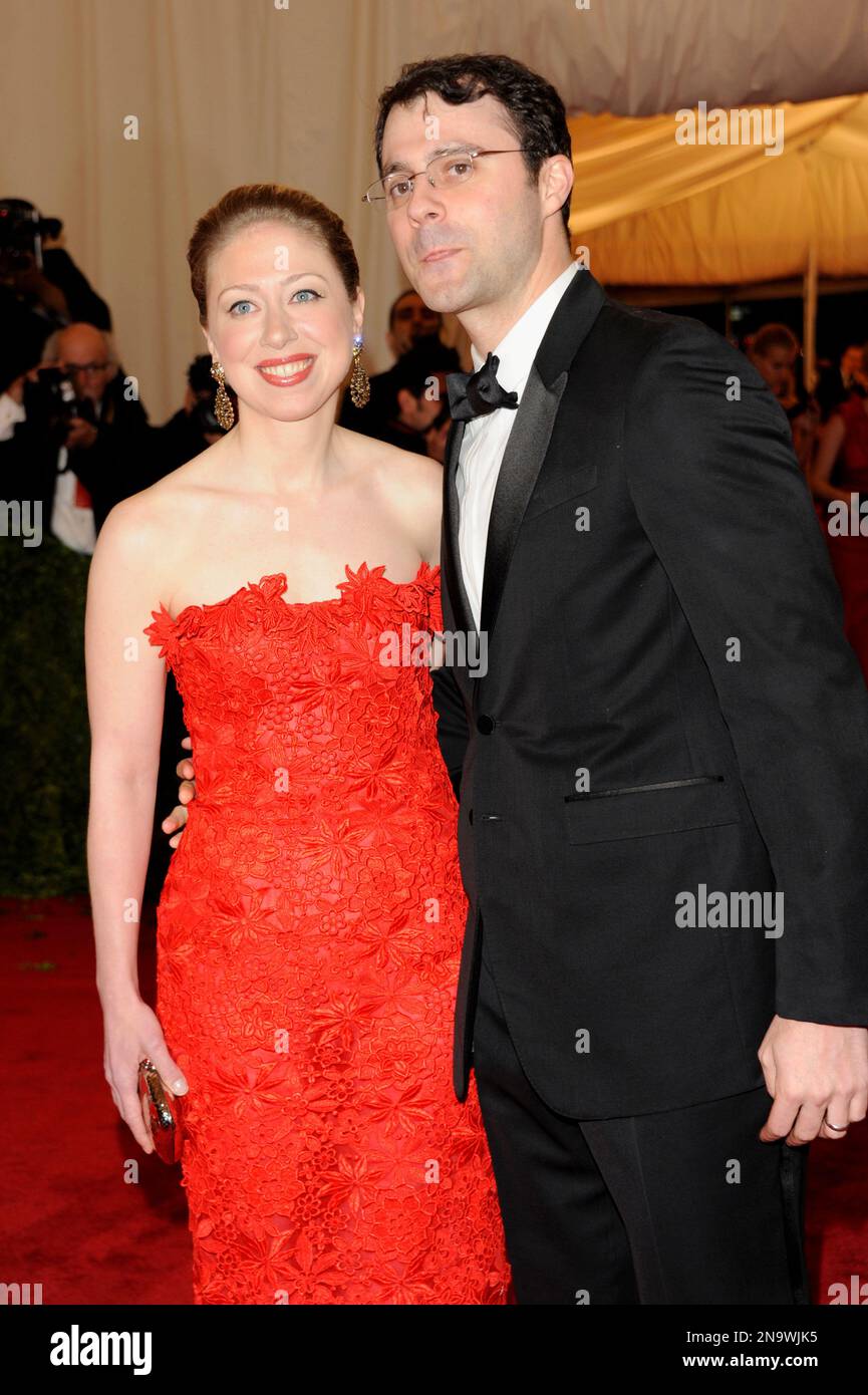 Chelsea Clinton, left, and her husband Marc Mezvinsky arrive at the ...