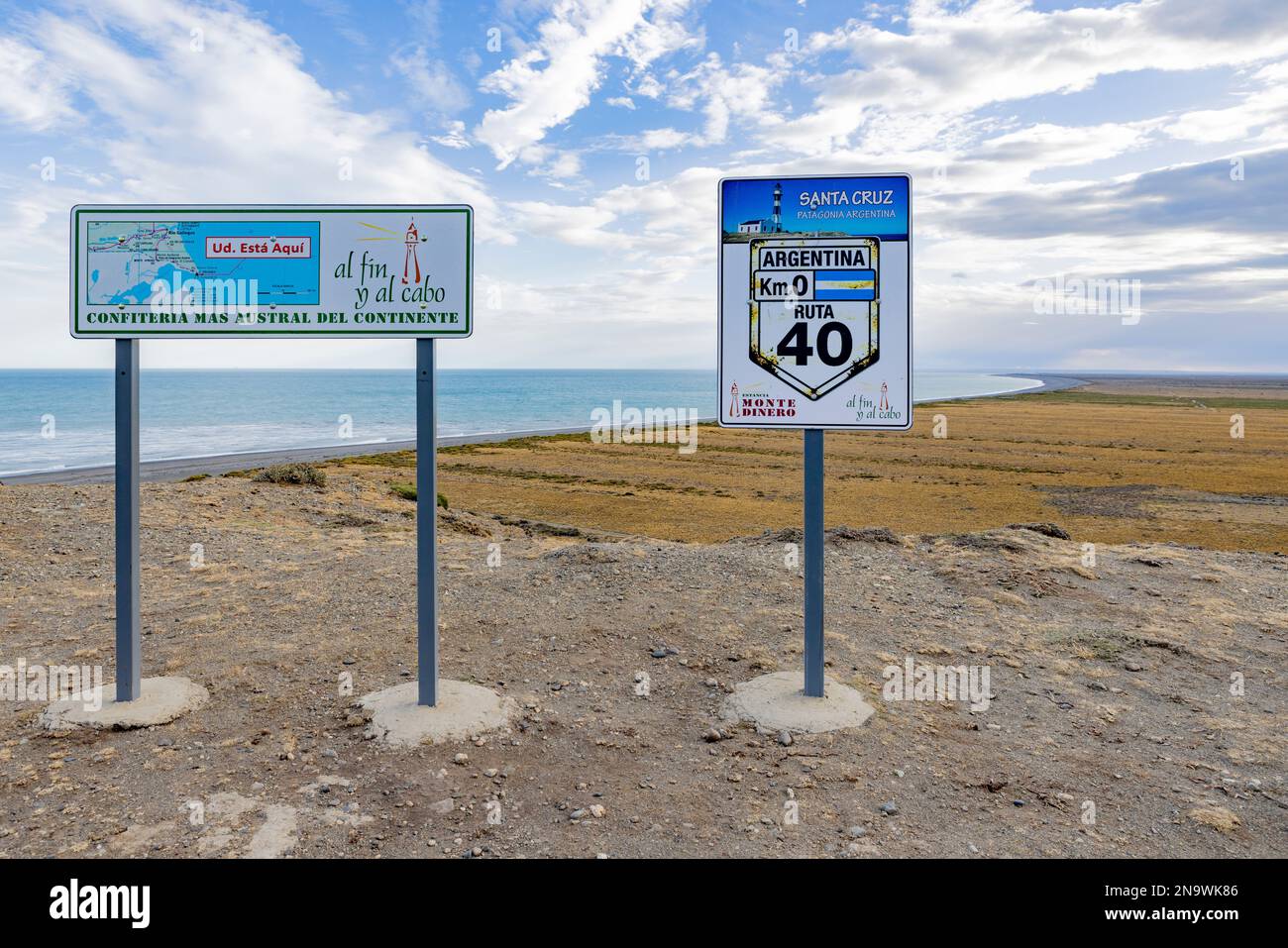 View to the coast of Cabo Virgenes and aluminum signs marking kilometer ...