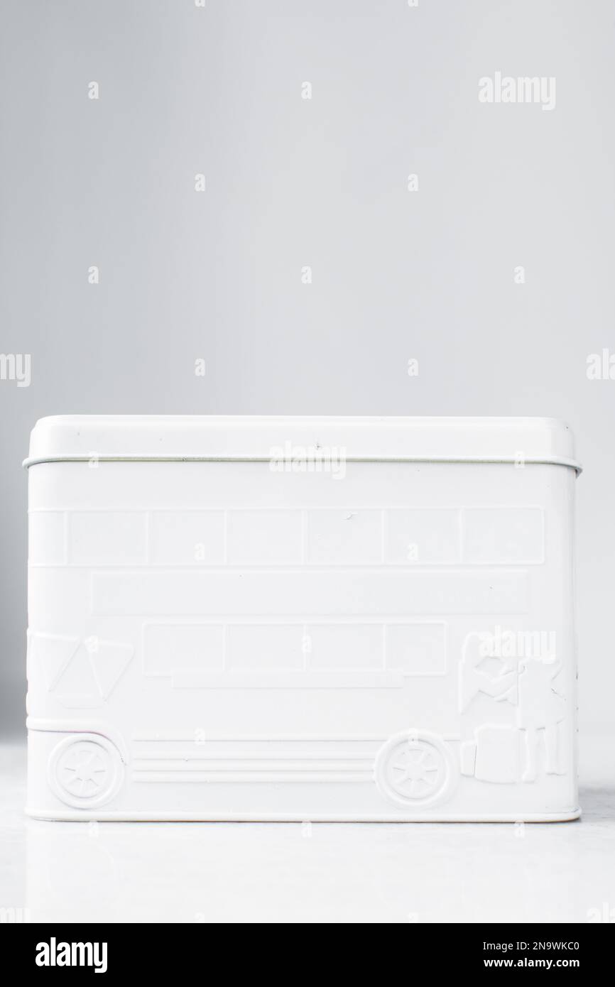 White metal piggy bank shaped like a double decker bus Stock Photo - Alamy