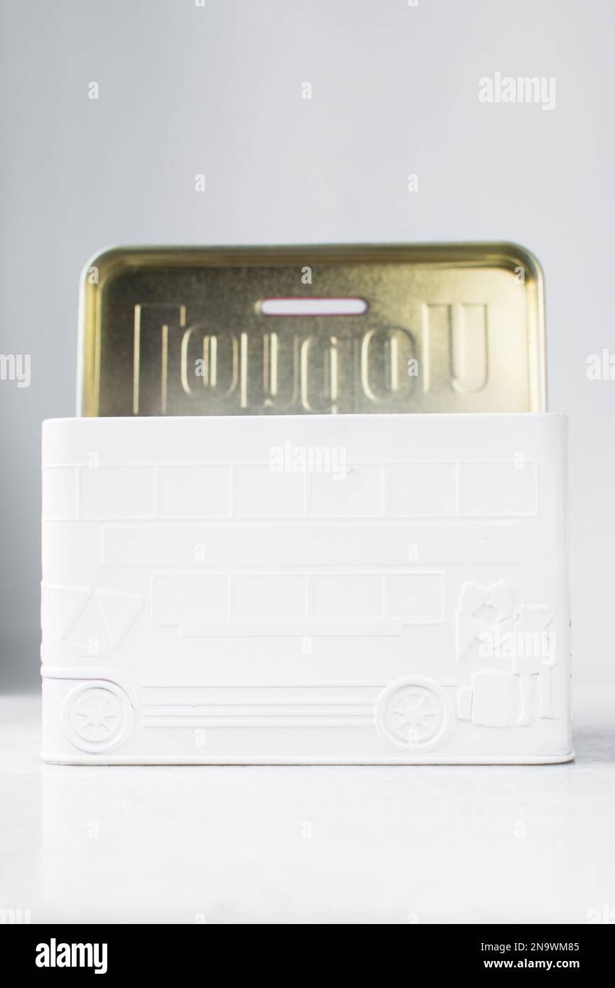 White metal piggy bank shaped like a double decker bus Stock Photo - Alamy
