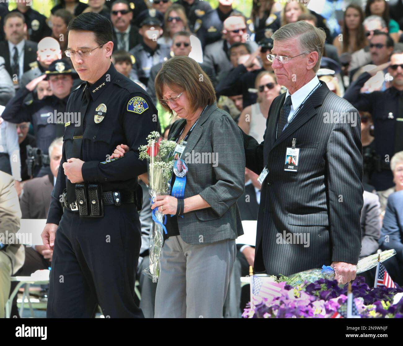 Alhanbra Police Chief Mark Yokoyama escorts Debbie and Sonny Stringer ...