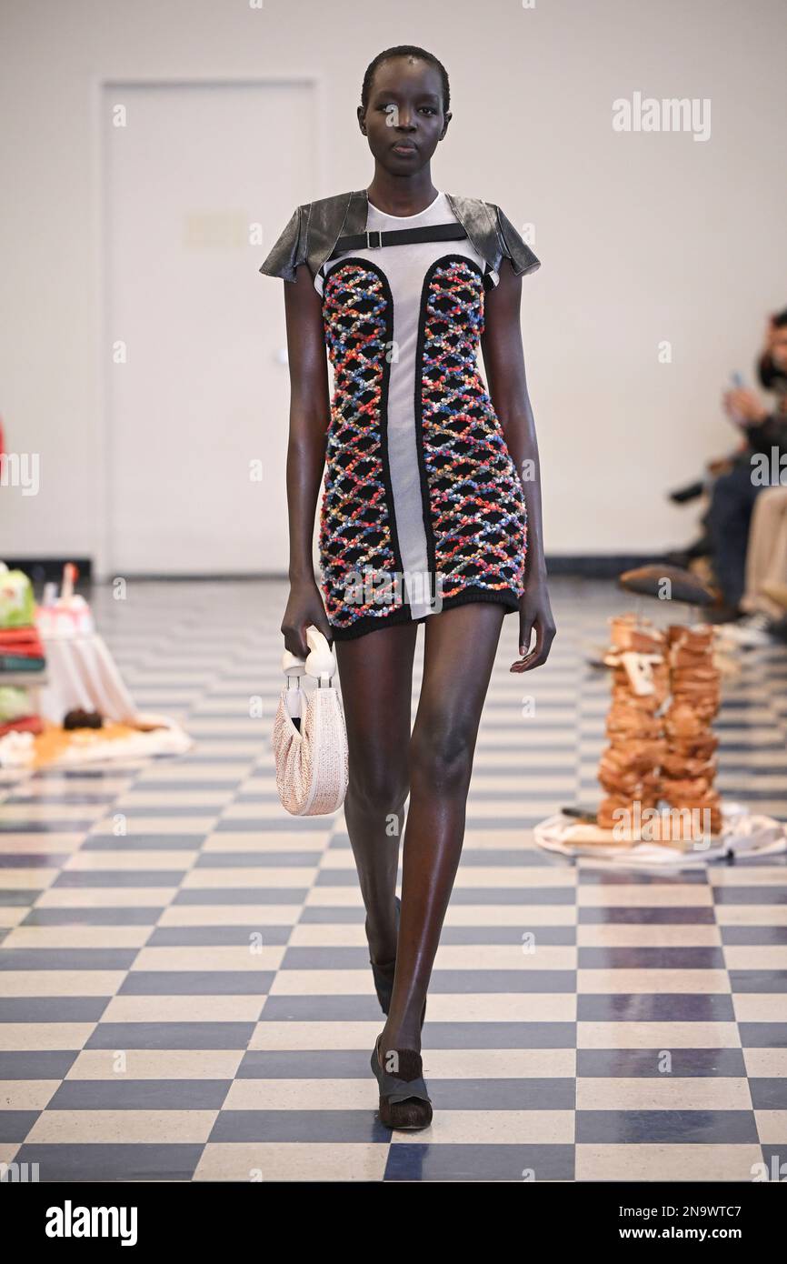 A model walks on the runway at the Puppets and Puppets fashion show ...