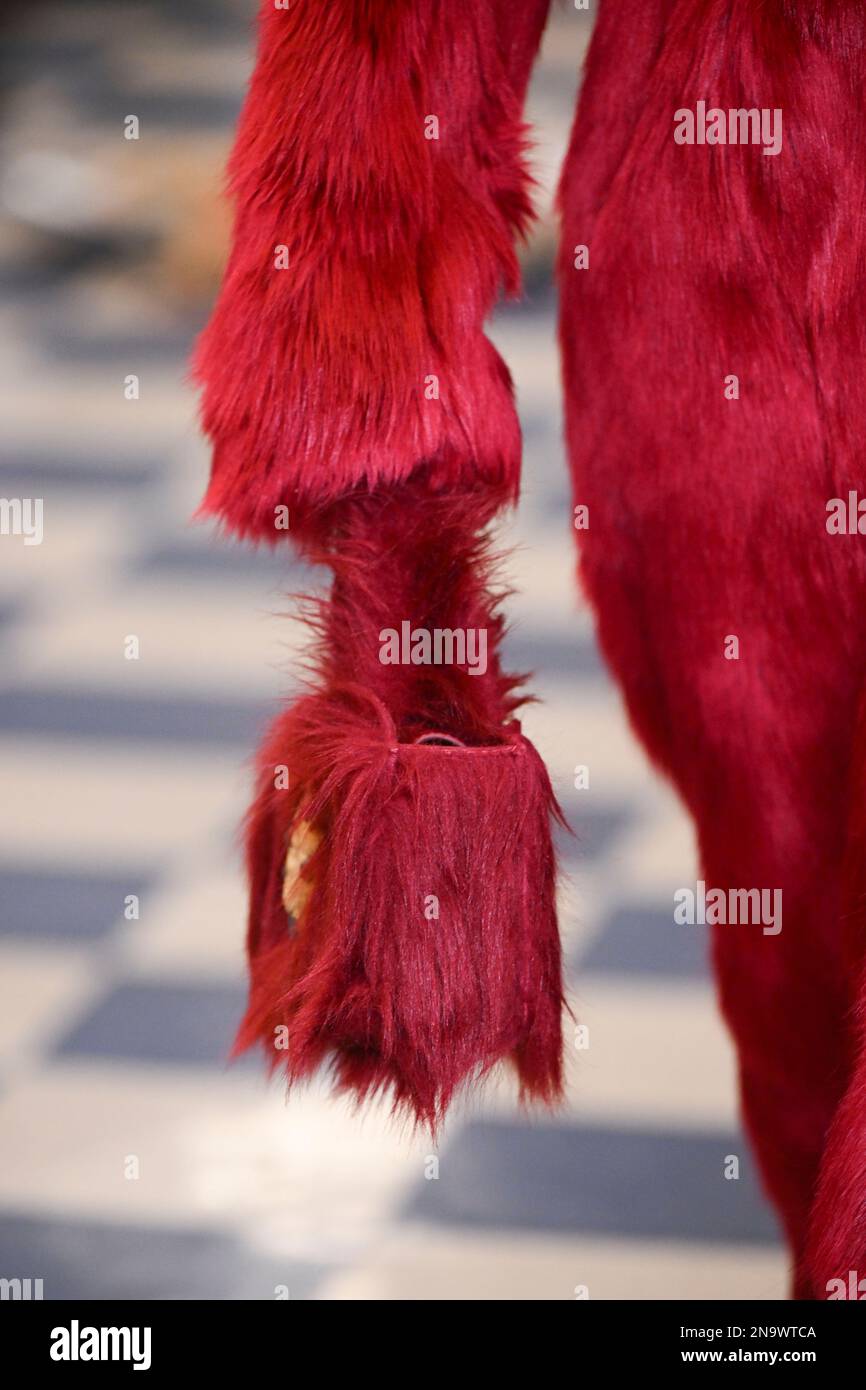 A model walks on the runway at the Puppets and Puppets fashion show ...