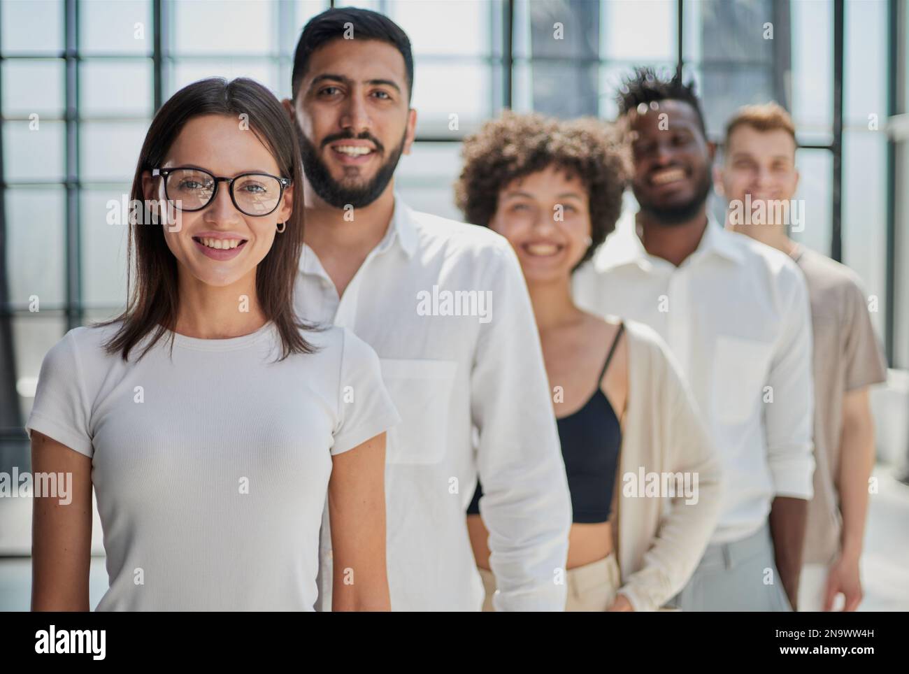Smiling professional business leaders and employees group team portrait ...