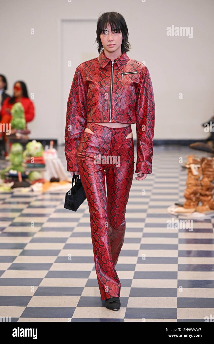 A model walks on the runway at the Puppets and Puppets fashion show ...