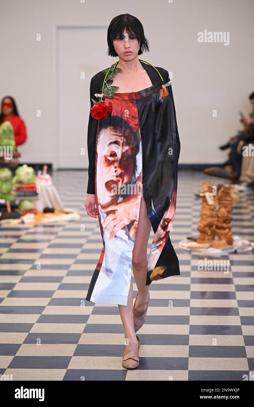 A model walks on the runway at the Puppets and Puppets fashion show ...