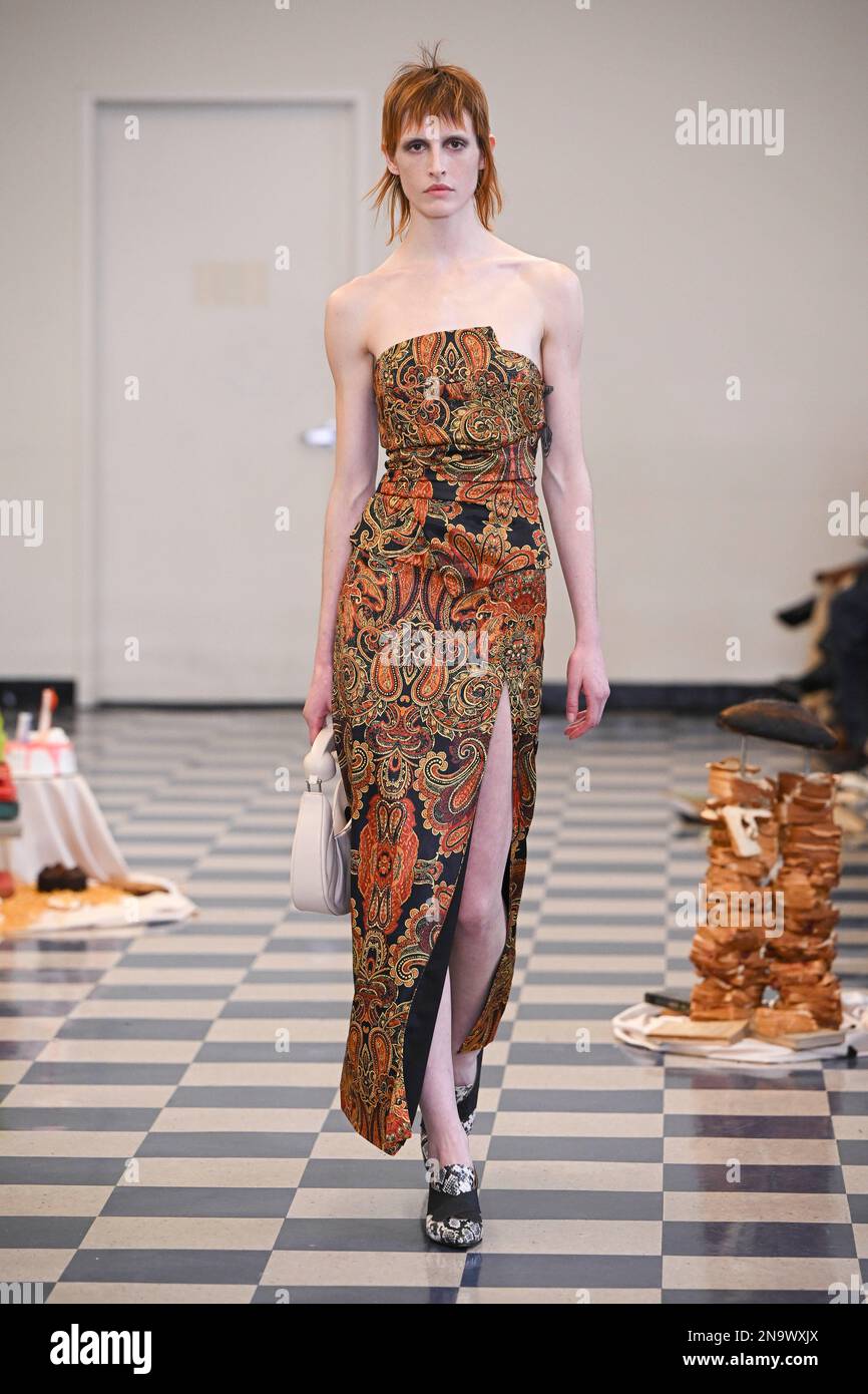 A model walks on the runway at the Puppets and Puppets fashion show ...
