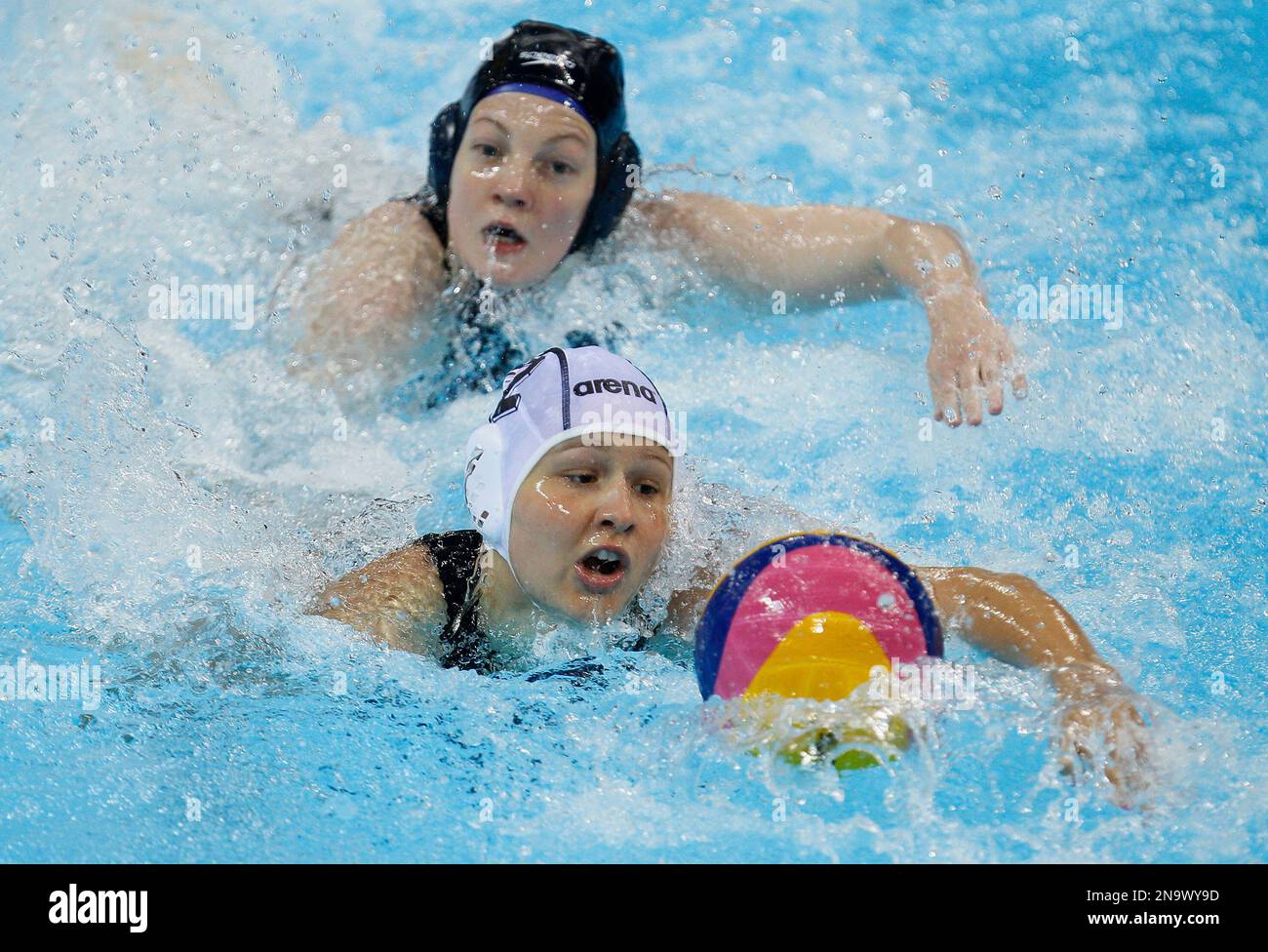 Hungary's Dora Csabai chases the ball pursued by Britain's Lisa Gibson ...