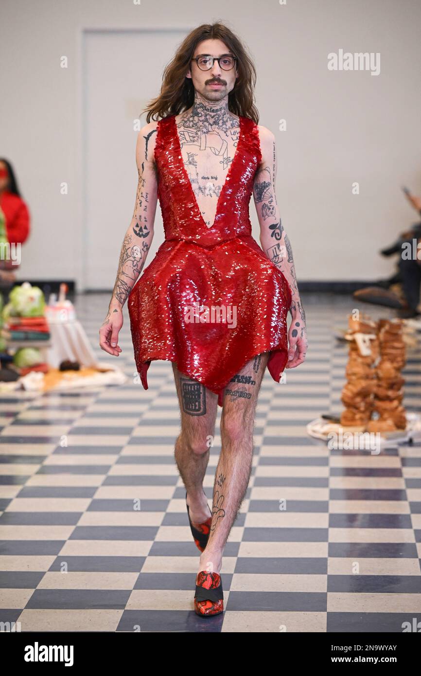A model walks on the runway at the Puppets and Puppets fashion show ...