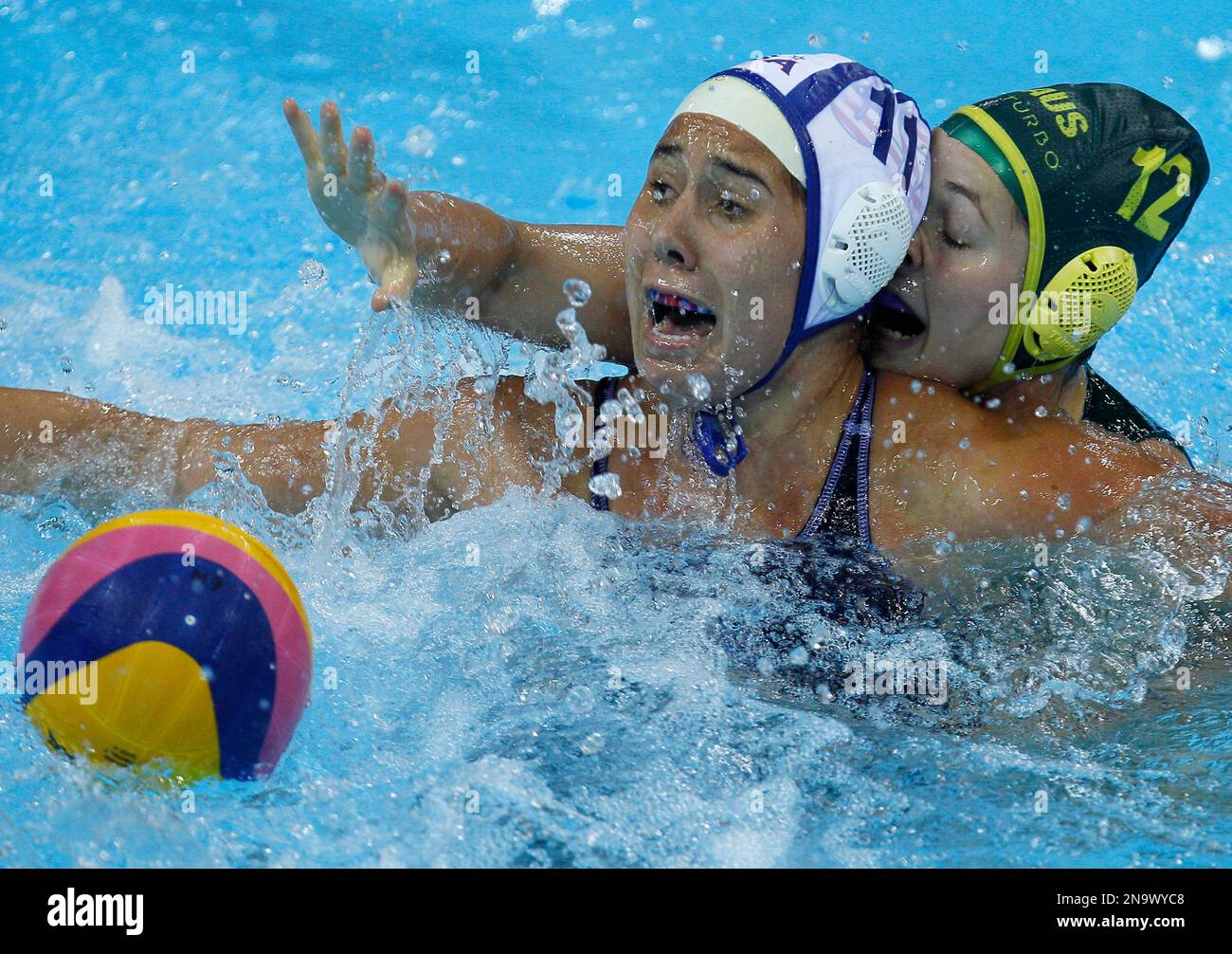 Annika Dries of the US, left, reacts as Australia's Nicola Zagame collides with her during the ...