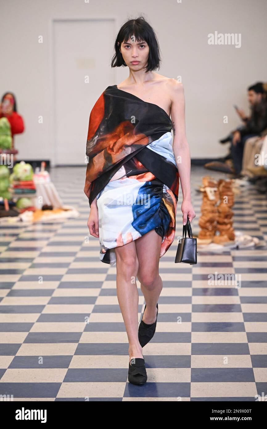 A model walks on the runway at the Puppets and Puppets fashion show ...