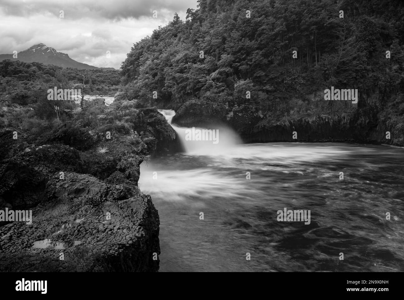 Clack and white view of river cascading down Petrohue Falls by the ...