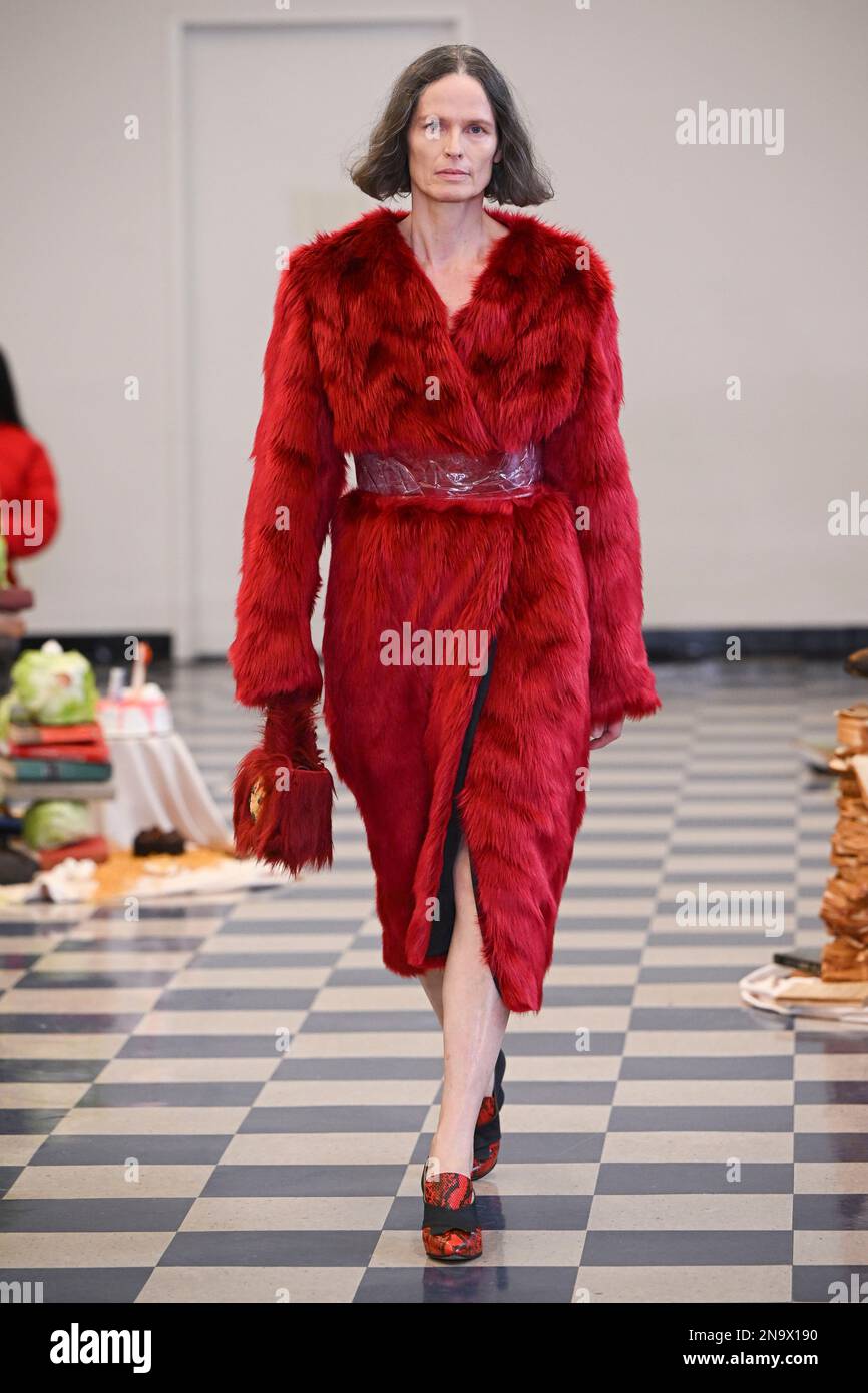 A model walks on the runway at the Puppets and Puppets fashion show ...
