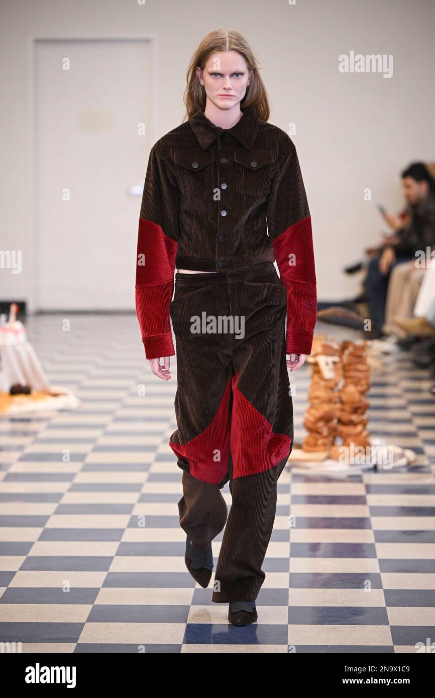 A model walks on the runway at the Puppets and Puppets fashion show ...