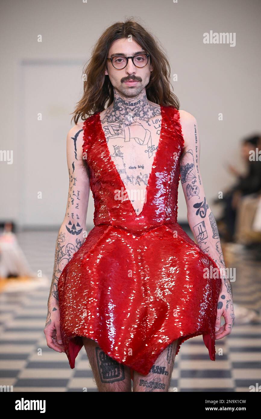 A model walks on the runway at the Puppets and Puppets fashion show ...