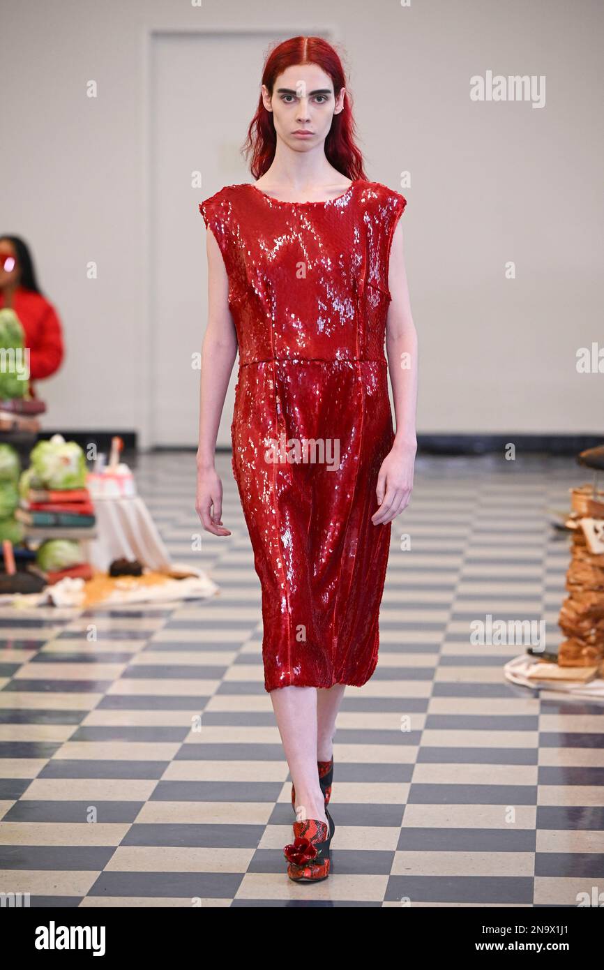 A model walks on the runway at the Puppets and Puppets fashion show ...