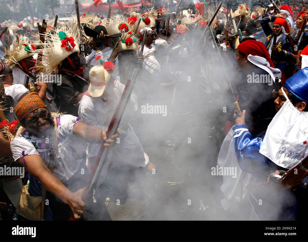People take part in a reenactment of the Battle of Puebla during Cinco ...