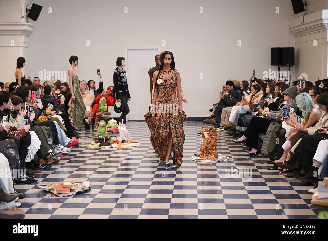 A model walks on the runway at the Puppets and Puppets fashion show ...