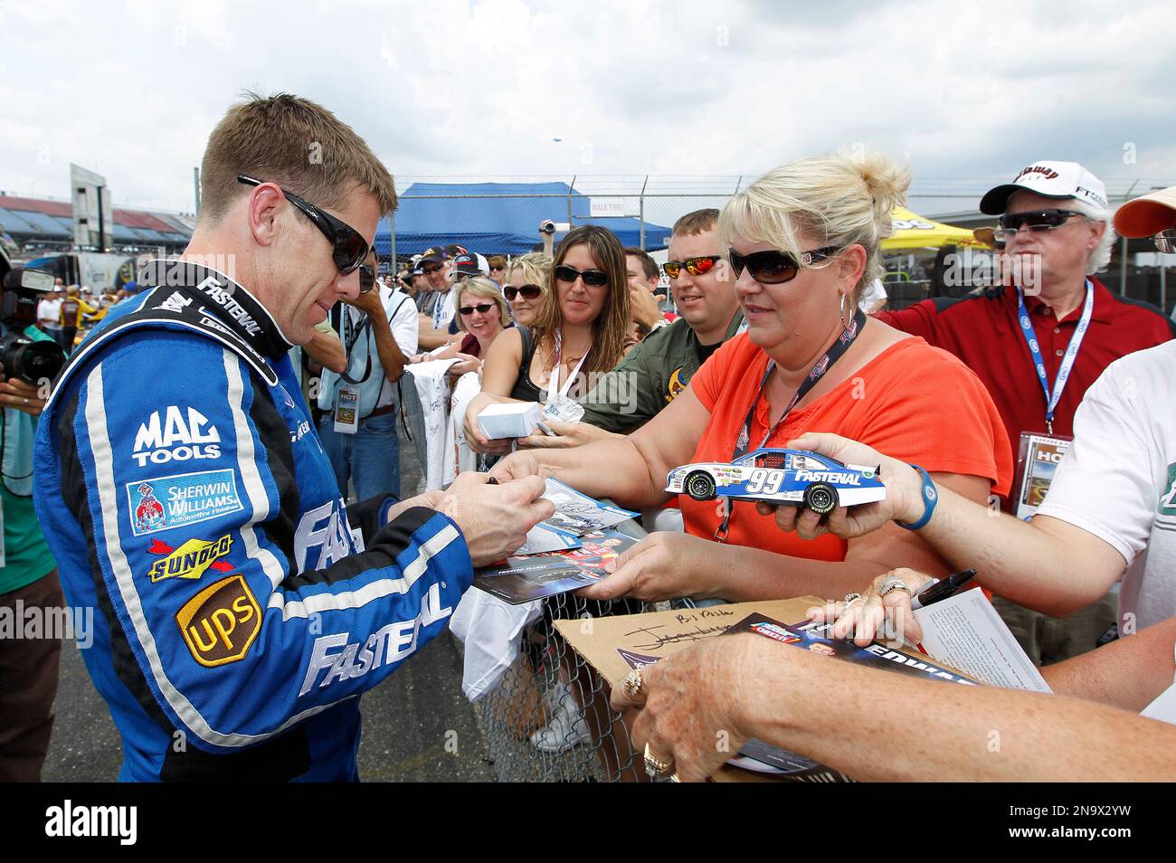 Driver Carl Edwards signs autographs after qualifying for Sunday's ...