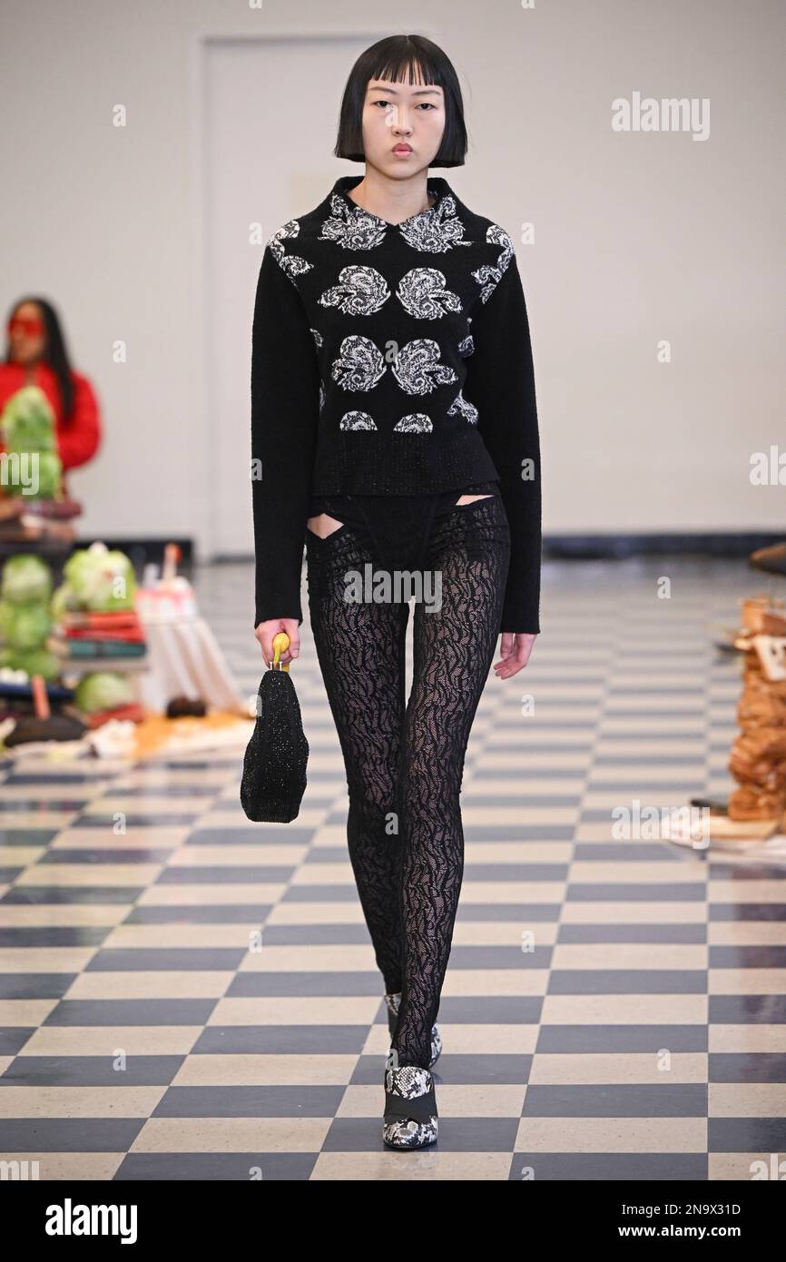 A model walks on the runway at the Puppets and Puppets fashion show ...