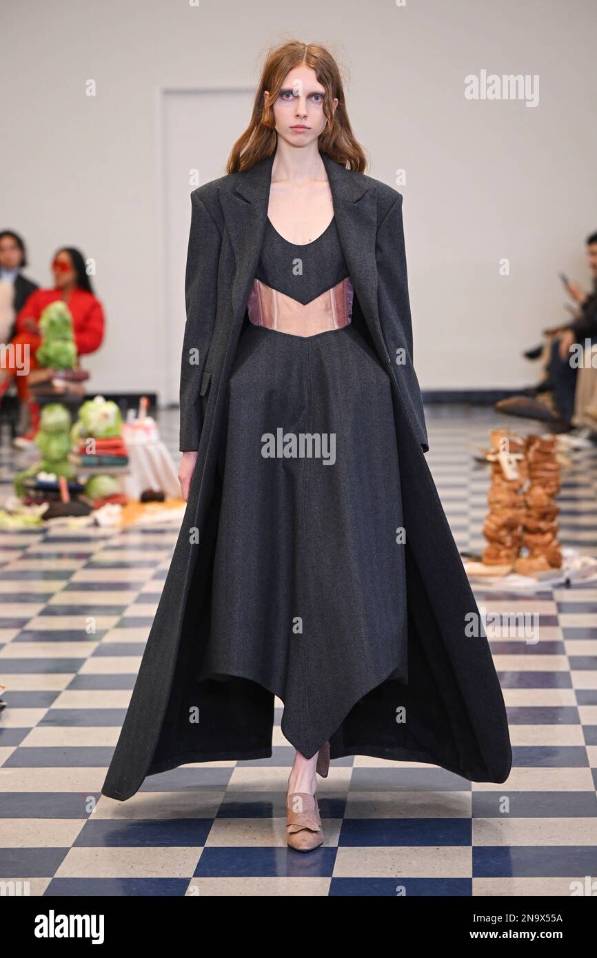 A model walks on the runway at the Puppets and Puppets fashion show ...