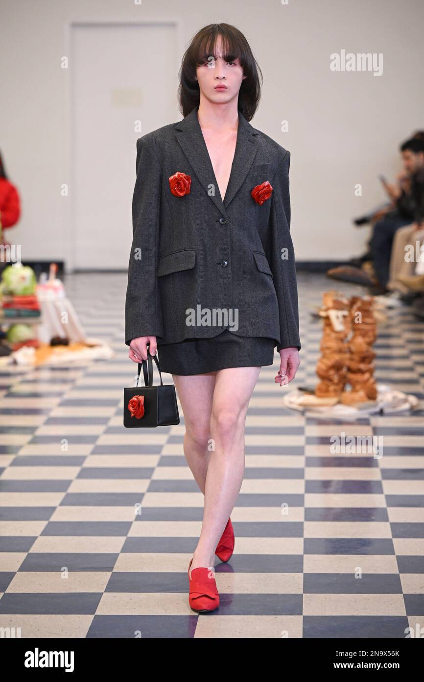 A model walks on the runway at the Puppets and Puppets fashion show ...